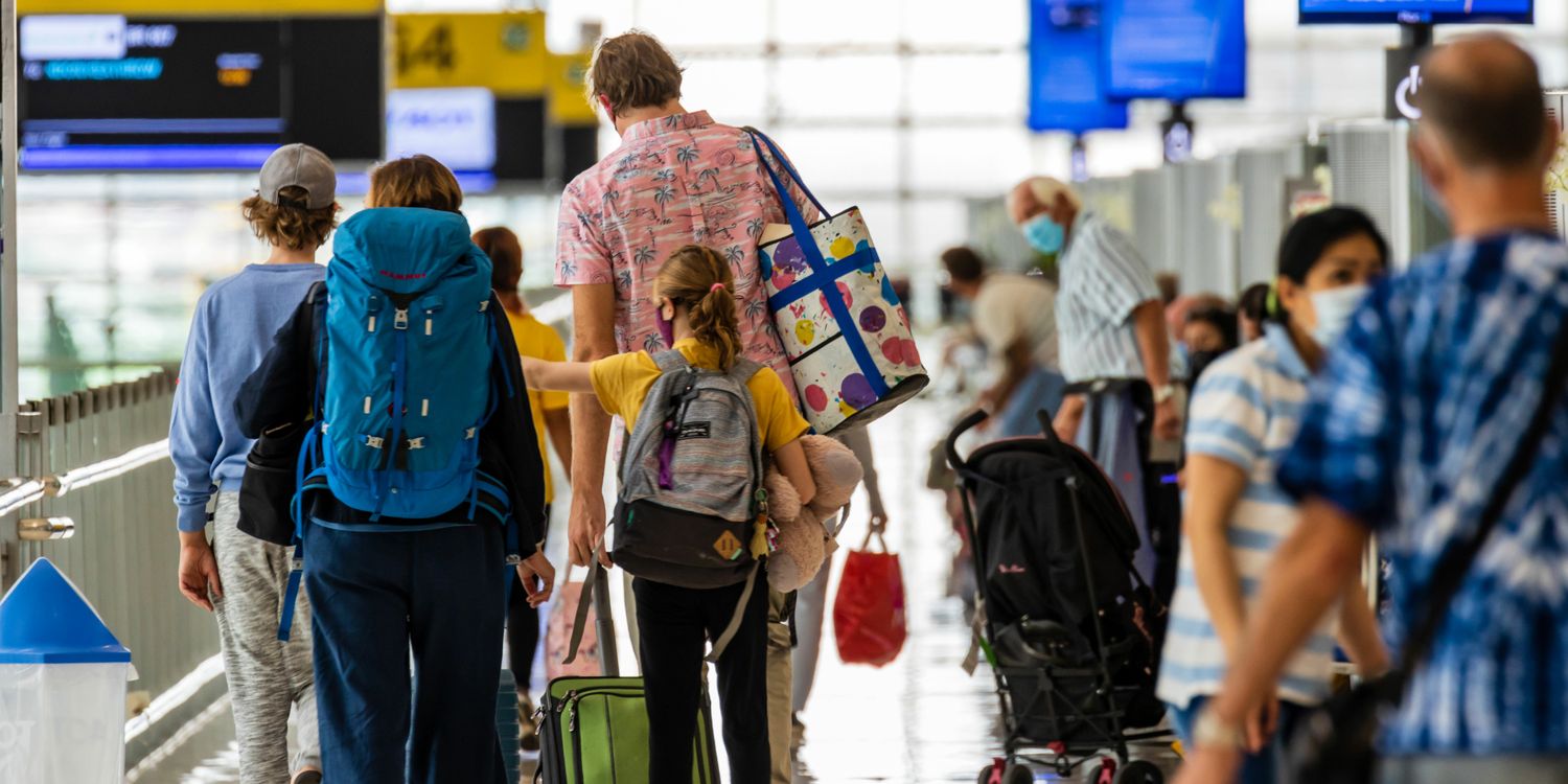 Passengers endure tightly packed security queue at Stansted Airport ...