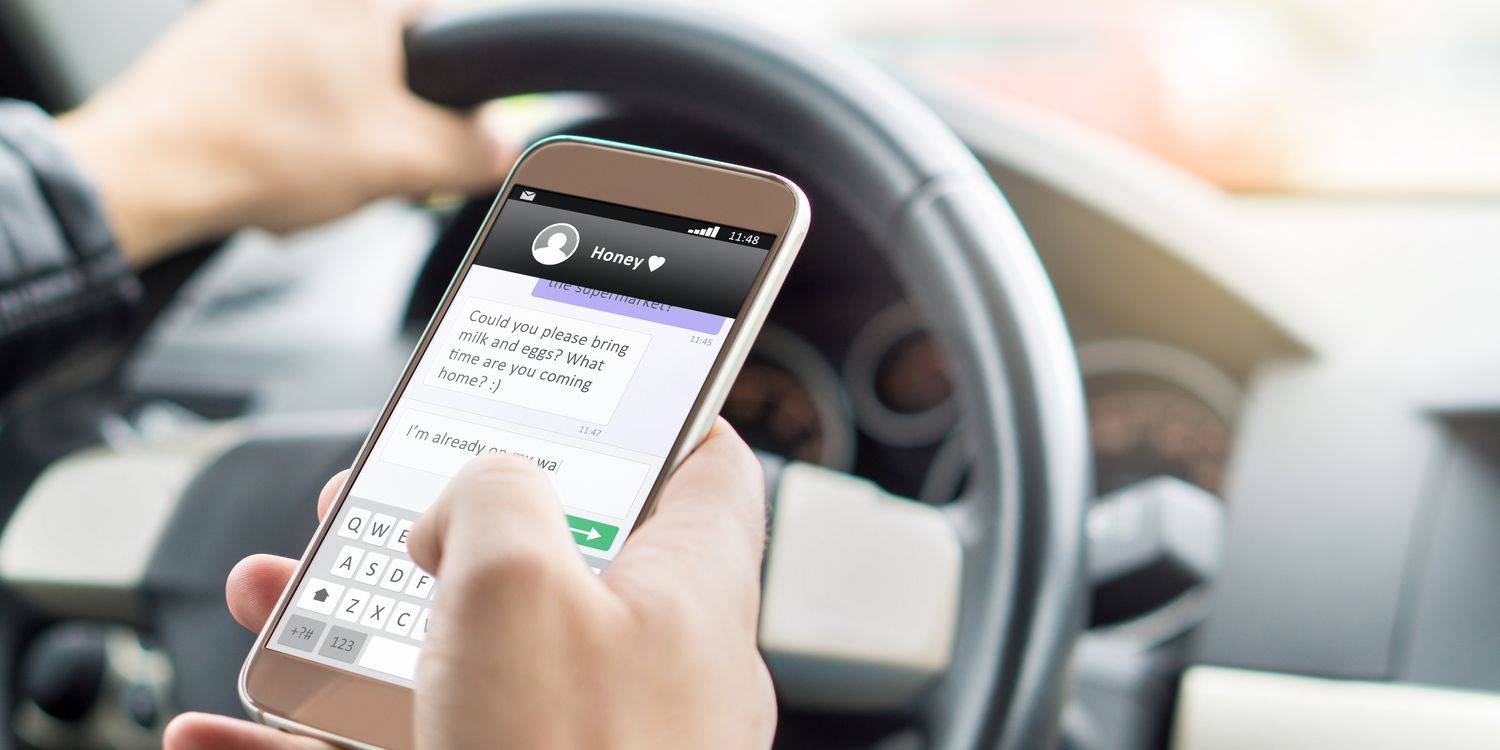 Does checking your phone while behind the wheel invalidate your car ...